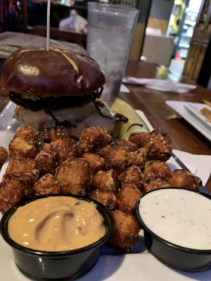 This burger with sweet potato tots isn't just lunch&mdash;it's an edible art installation with dipping sauces as the perfect supporting cast. 