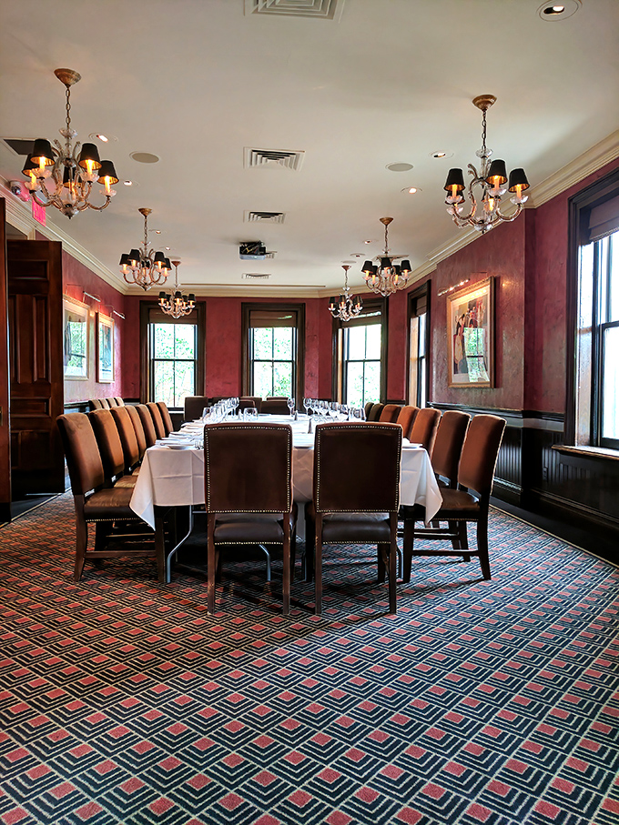 The private dining room whispers "important occasion" without shouting it—burgundy walls holding secrets of countless celebrations.