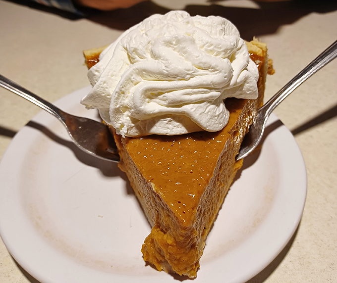 This isn't just pumpkin pie &ndash; it's autumn on a plate, topped with a cloud of whipped cream that makes every forkful a perfect bite.