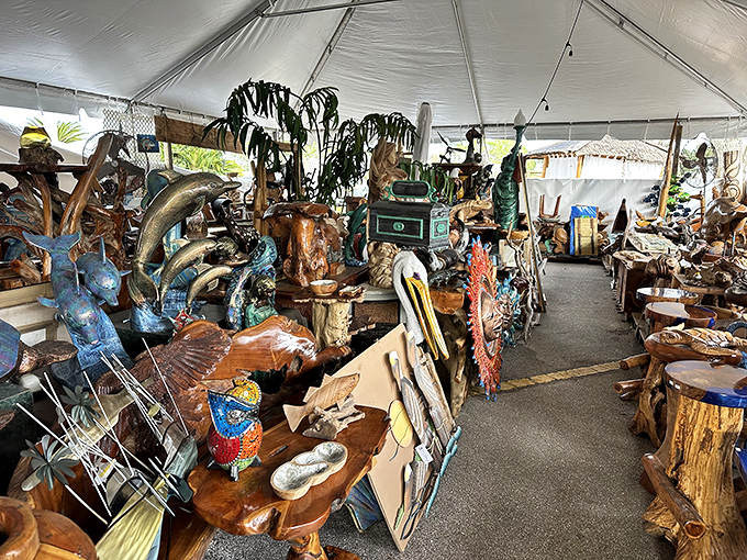 Woodworking meets marine life in this tent of carved treasures. That dolphin coffee table isn't just furniture&mdash;it's a commitment to coastal living.