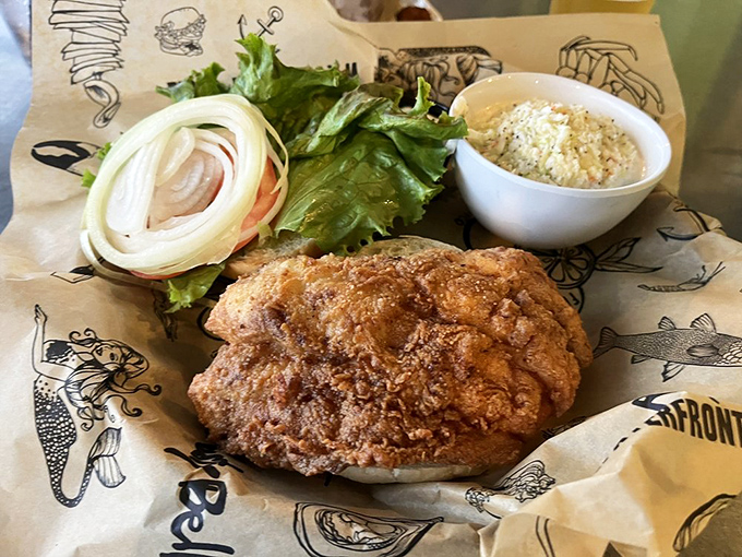 This isn't just a fish sandwich&mdash;it's a monument to the mighty grouper, proudly displaying its crispy credentials alongside creamy coleslaw.