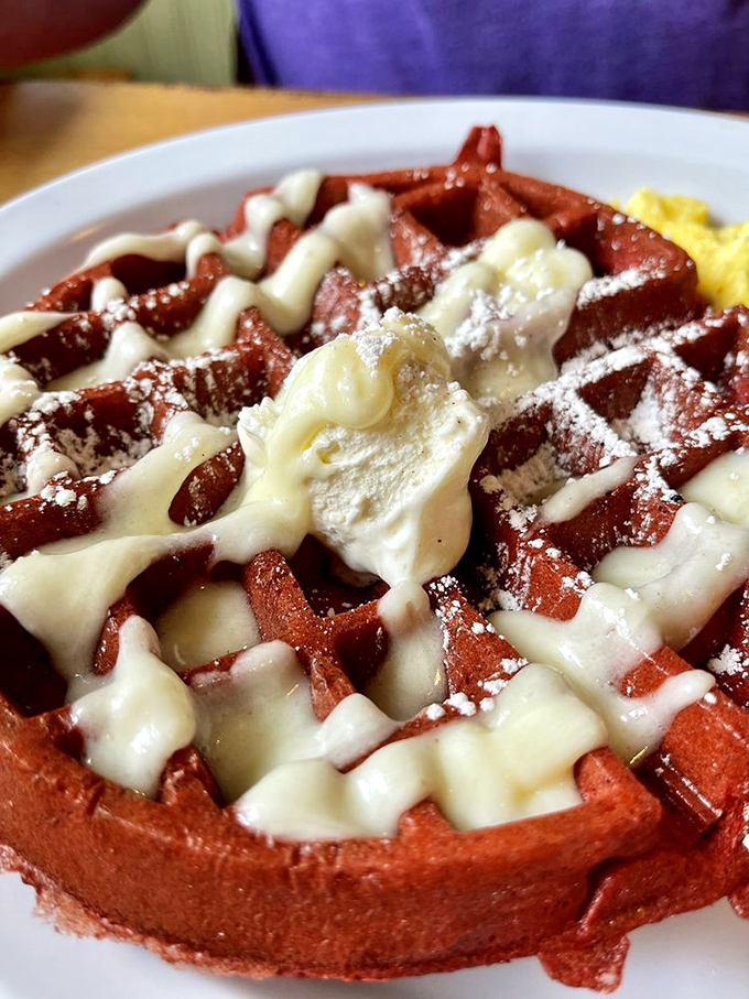 Up close with the red velvet waffle&mdash;where breakfast meets dessert and nobody's complaining about the introduction.