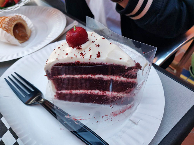 This red velvet cake slice isn't playing around&mdash;it's three layers of crimson intensity that makes grocery store versions hang their heads in shame.