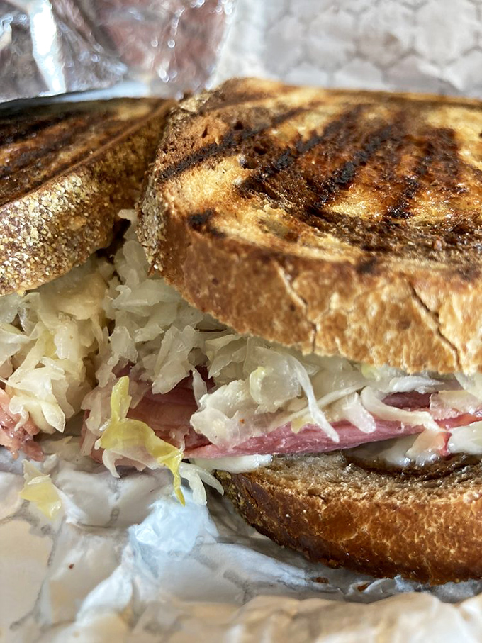 A proper Reuben should require both hands and at least three napkins. This one passes the test with flying, slightly greasy colors.