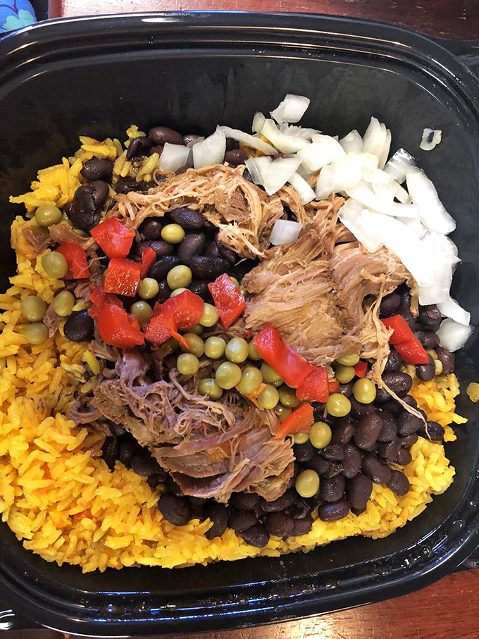 This isn't just rice and beans&mdash;it's a canvas where tender pork, peppers, and onions create an edible masterpiece that puts fancy plating to shame.