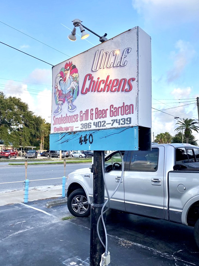 The roadside sign stands as a beacon to hungry travelers. Like a lighthouse guiding ships to safe harbor, it directs empty stomachs to crispy salvation.