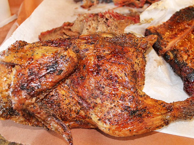 This chicken has achieved a color that should be added to the Pantone catalog—"Snow's Mahogany," perhaps? Glistening with juices, promising perfection.