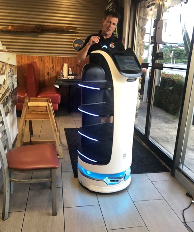 The future of food service has arrived—this robot waiter delivers burgers without ever asking about your weekend plans.
