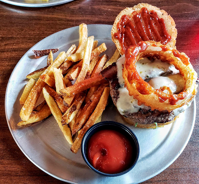 The Rodeo burger with its crispy onion ring crown proves that sometimes more is more. This isn't minimalism; it's maximalism you can eat.