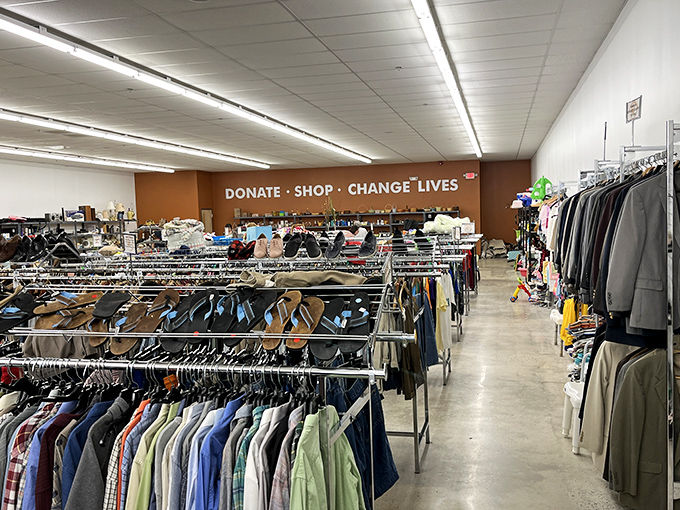 "DONATE &middot; SHOP &middot; CHANGE LIVES" says it all. Racks of possibility stretch before you in this fashion treasure hunt with purpose.