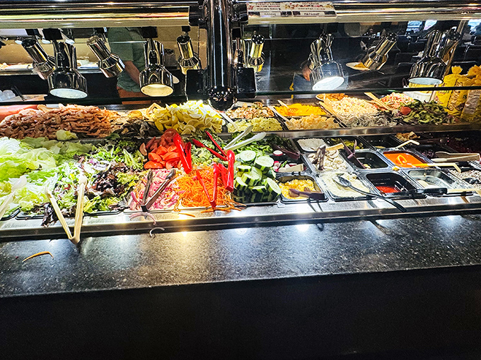 The salad bar offers a rainbow of fresh vegetables and toppings, providing either virtuous starters or strategic palate cleansers between indulgences.
