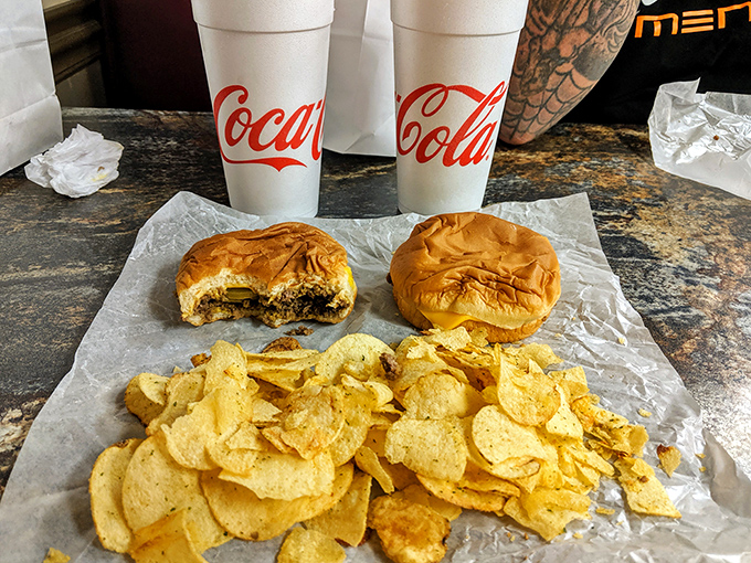 Classic combo perfection &ndash; sandwich, chips, and Coca-Cola creating the holy trinity of comfort food satisfaction.