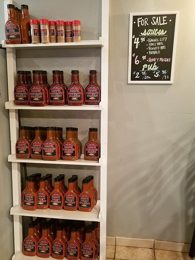 Bottles of house-made sauces and rubs line the shelves, ready to take the flavor home.