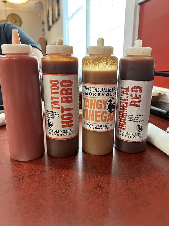 The sauce lineup – from tangy vinegar to sweet tomato – ready to customize your barbecue experience like a smoky choose-your-own-adventure.
