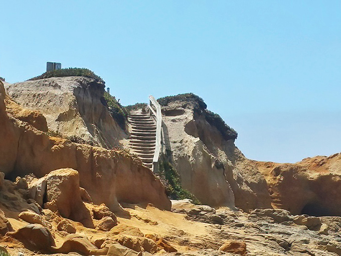 Stairway to heaven, beach edition. These sun-drenched steps promise adventure above and below, with views worth every single sandy step.
