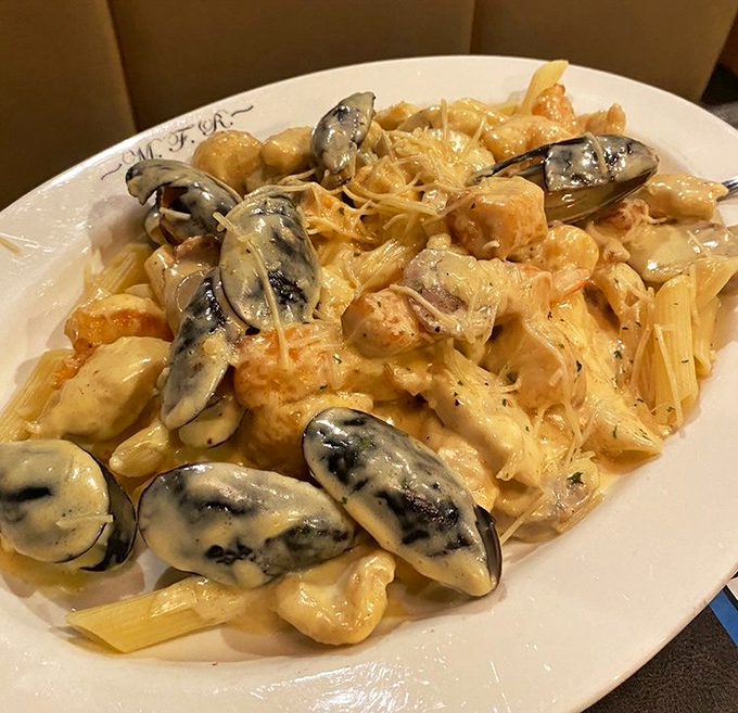 Seafood Stephanie &ndash; where cream sauce meets shellfish in perfect harmony. Those mussels look like they're swimming in a pool of pure indulgence.
