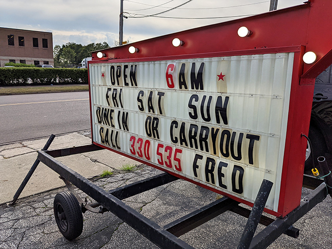The roadside sign tells you everything you need to know: Fred's opens early, closes late, and welcomes both dine-in and carry-out breakfast enthusiasts.