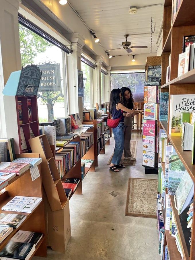 The narrow aisles of the bookstore section create the perfect excuse for literary-minded souls to "accidentally" brush shoulders while reaching for the same novel.