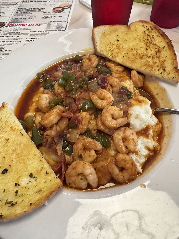 Shrimp and grits with a Florida twist&mdash;plump crustaceans swimming in savory broth alongside garlic toast perfect for sopping up every last drop.