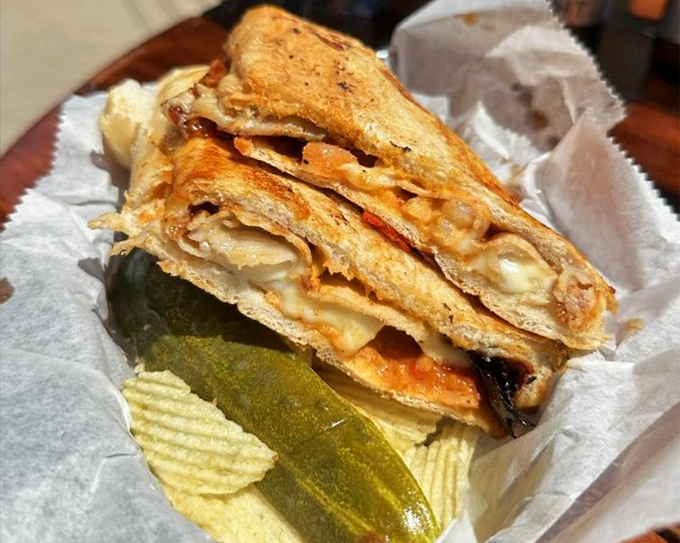 The Shrimp Cubano sandwich doesn't just blur cultural lines—it erases them in a glorious fusion of flavors that demands both hands and extra napkins.