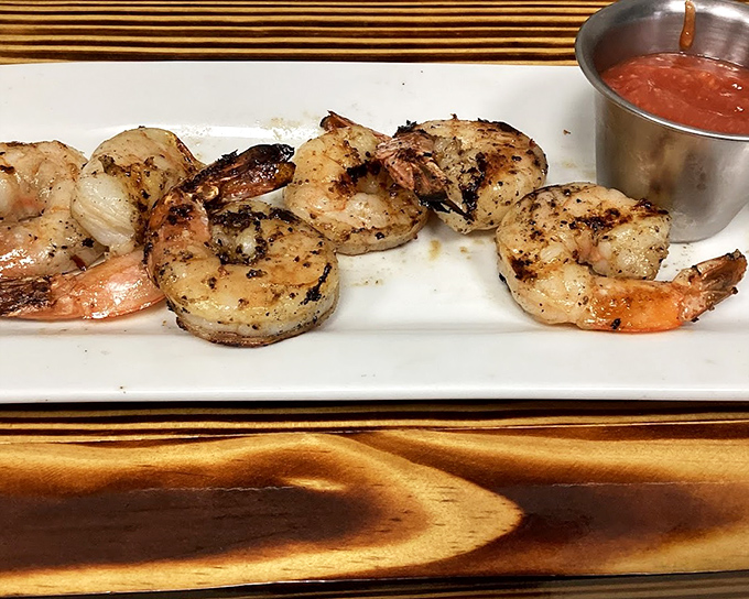Grilled shrimp arranged like a necklace of oceanic pearls. Simple preparation letting quality ingredients speak their delicious truth. 