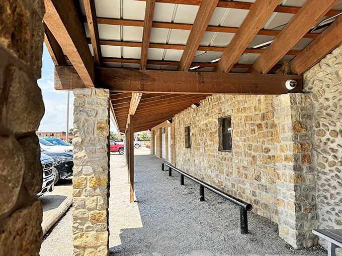 Rustic wooden beams and native stone create a shaded respite from the Texas sun. Architecture that's purely functional becomes beautiful.