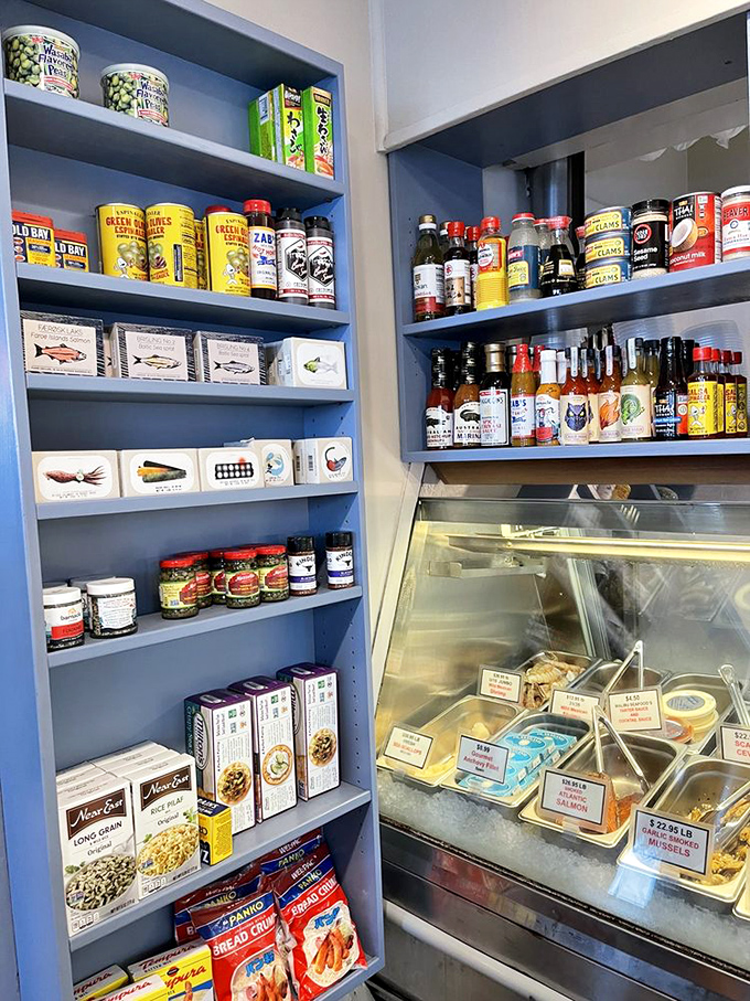 The pantry wall is like a global spice expedition. These shelves hold the secret weapons that transform good seafood into greatness.