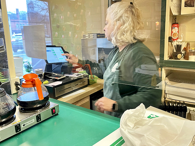 The unsung heroes of breakfast happiness, working their magic behind plexiglass. Their hands create what our hearts desire.