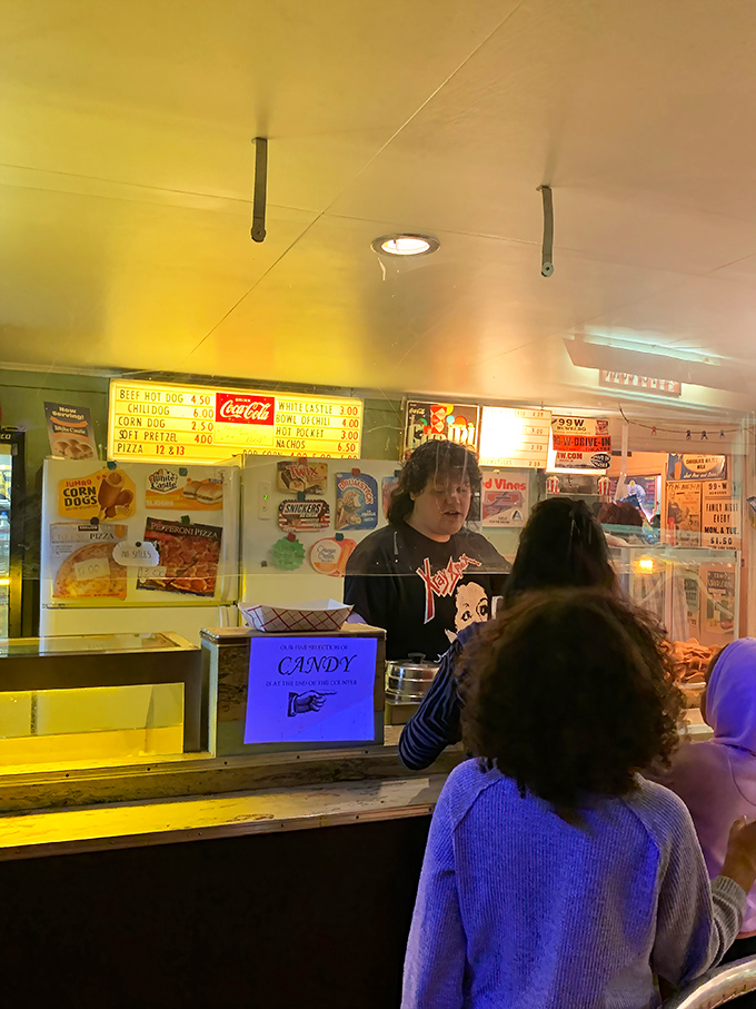 The concession stand's warm glow beckons moviegoers like moths to flame&mdash;candy, conversation, and community all served with a smile. 