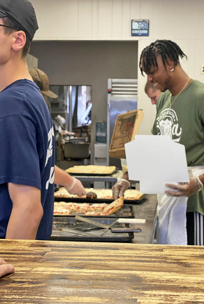 Watch the masters at work, turning simple ingredients into edible gold with practiced precision and pride.