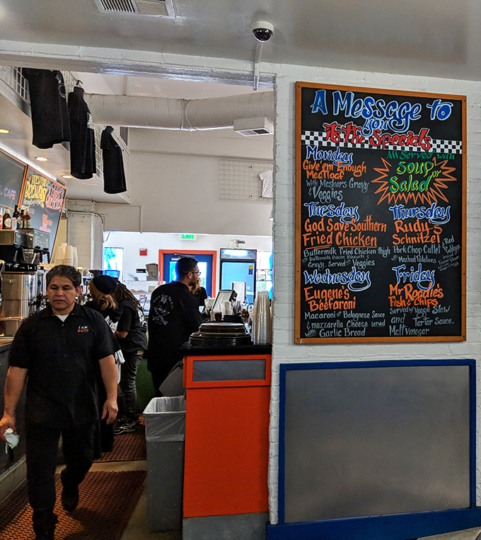 A colorful chalkboard announces daily specials with the enthusiasm of a town crier who really, really loves comfort food.