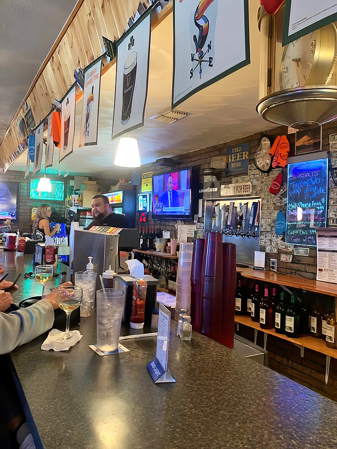 Bartenders who pour with purpose, surrounded by the tools of their trade. The neon glow is nature's way of saying "good decisions happen here."