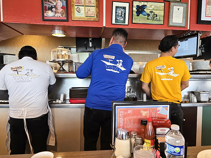 The kitchen crew wears their Pann's pride on their backs. These are the unsung heroes behind that legendary fried chicken.