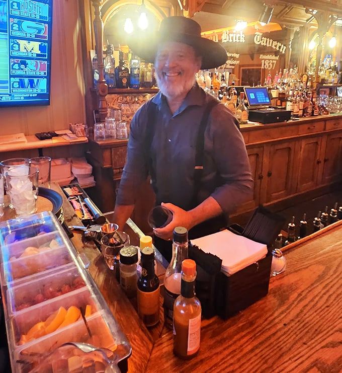 The bartender, complete with period-appropriate hat, embodies the tavern's blend of historical charm and genuine hospitality that keeps guests coming back. 