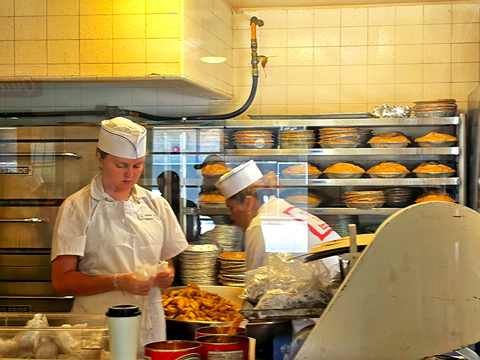 White uniforms and paper hats&mdash;the timeless uniform of burger artisans who've mastered their craft through decades of practice.