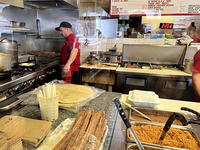 The kitchen maestros at work. Like watching a delicious symphony where every movement ends with someone saying "m&aacute;s, por favor."