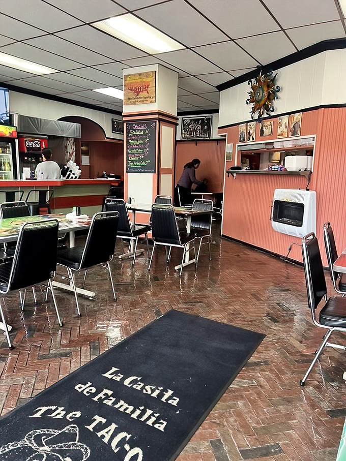 The brick floor and personalized welcome mat say "mi casa es su casa" before anyone even speaks a word.