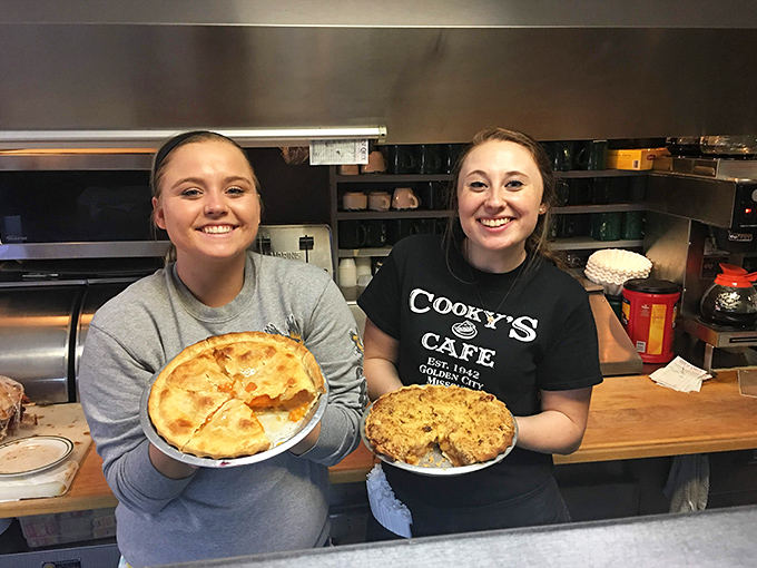 The guardians of the pie tradition hold their creations with the pride of artists who work in flour, butter, and fruit instead of paint and canvas.