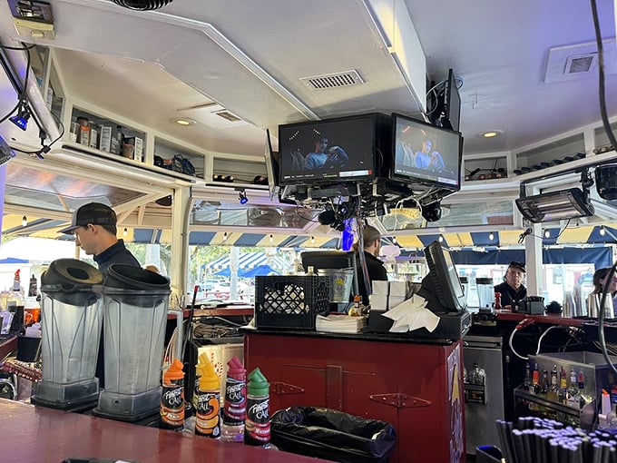 Behind every great meal is a team that makes the magic happen. The bar area buzzes with the energy of cocktail creation.