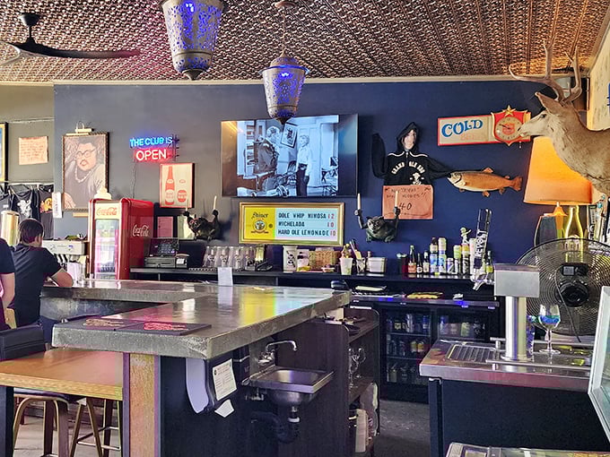 The bar area&mdash;where taxidermy meets neon in a uniquely American celebration of cold drinks and hot BBQ.