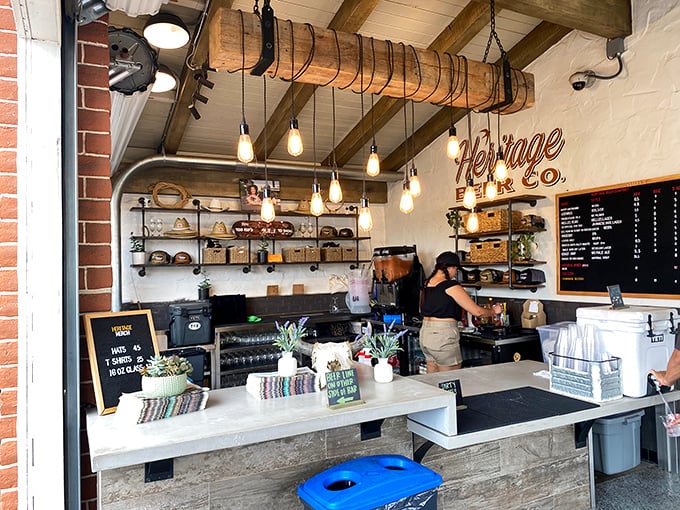 Edison bulbs illuminate the counter where dreams come true. The staff moves with the choreographed precision of barbecue ballet.