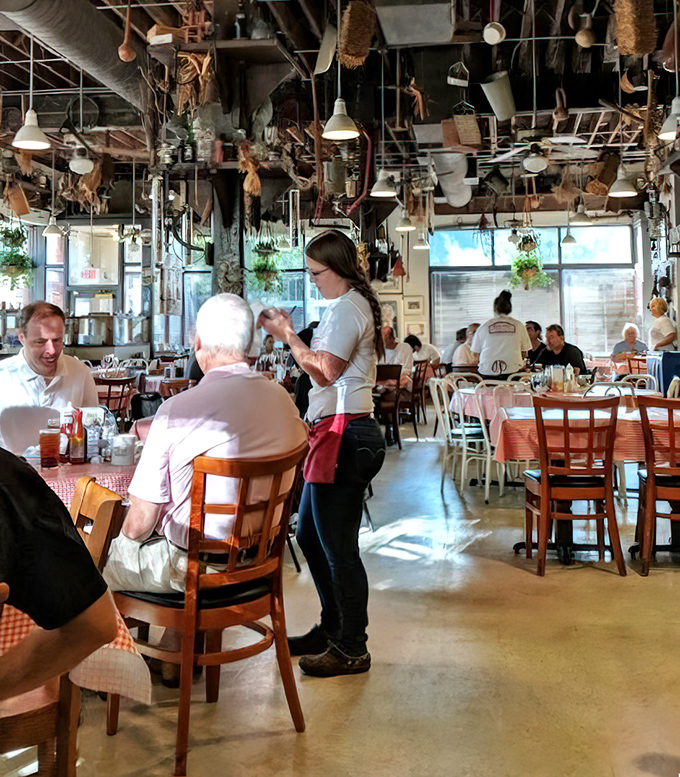 Servers at Big Ed's don't just bring food&mdash;they deliver happiness on plates while navigating a ceiling museum of agricultural artifacts with practiced ease.