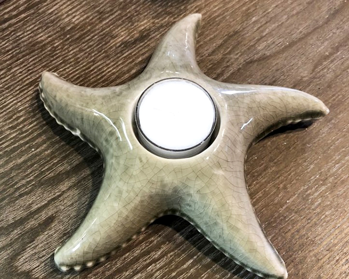 This ceramic starfish tealight holder brings coastal vibes to landlocked Ohio. Beach house ambiance without the sand in your shoes!