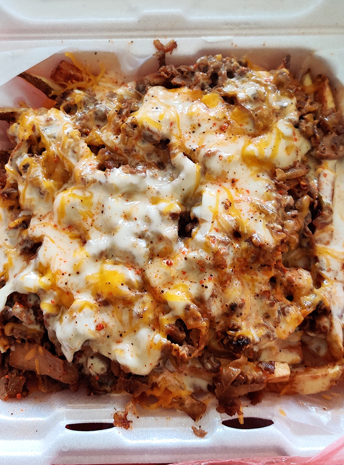 Steak bang bang fries loaded with enough toppings to qualify as a complete food group experience.
