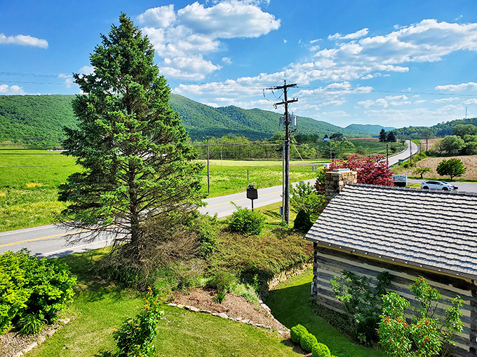 The view that makes you understand why settlers stopped here&mdash;rolling Pennsylvania hills unfold like a living landscape painting from the tavern's perfect perch.