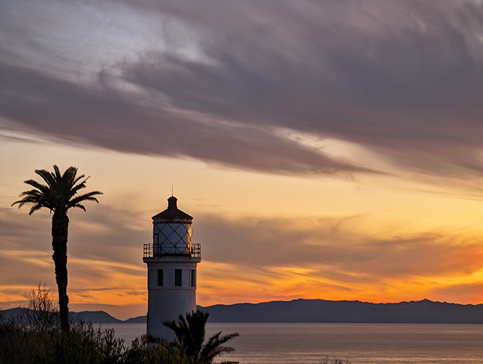Sunset transforms the lighthouse into a silhouette artist's dream. Even the clouds showed up dressed for the occasion.