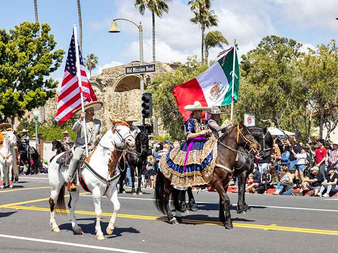 The Swallow's Day Parade celebrates heritage on horseback, with riders proudly carrying flags that tell California's multicultural story.
