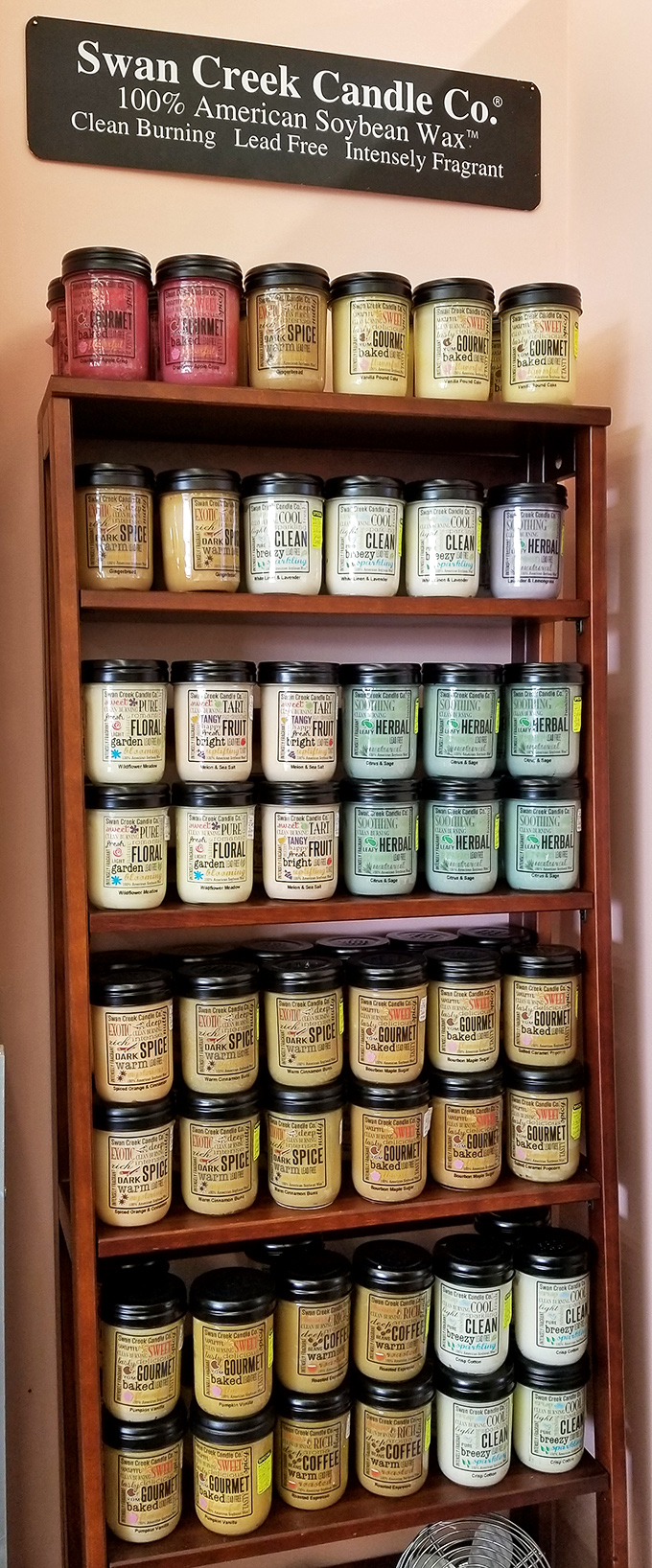 Swan Creek Candles arranged with military precision offer a fragrant journey from "Gourmet Baked" to "Clean" to "Herbal." Scent shopping at its finest.