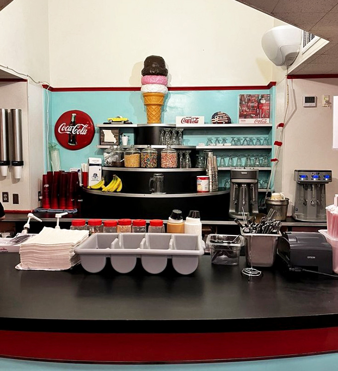 The sweet treats station stands ready for action, crowned by an ice cream cone sculpture that never melts.