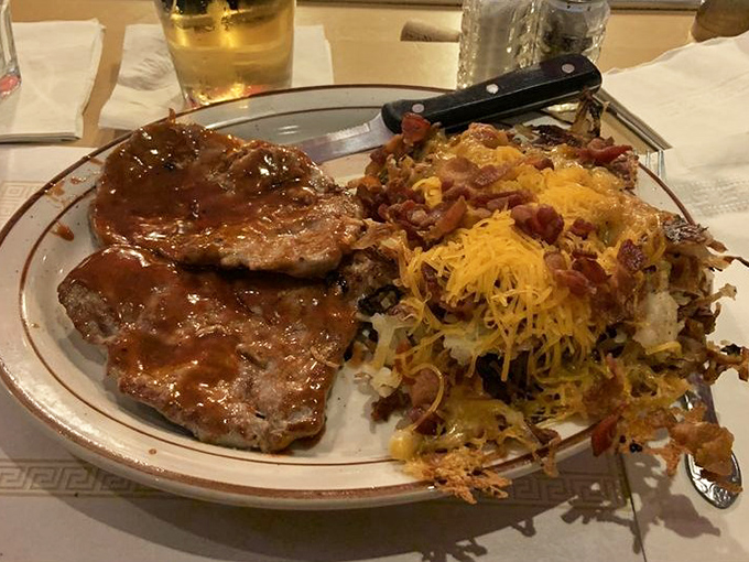 Tenderloin topped with enough cheese and bacon to make a cardiologist weep with joy.